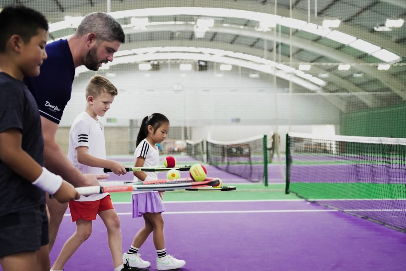 Kids tennis lessons near you | David Lloyd Clubs